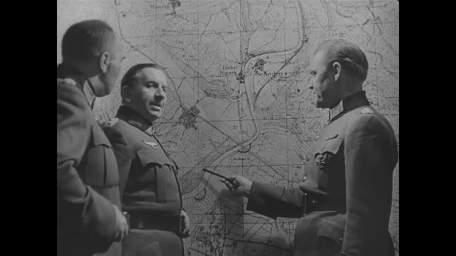 1940s: Nazi officers speak and gesture at map. Soldiers in battlefield ...