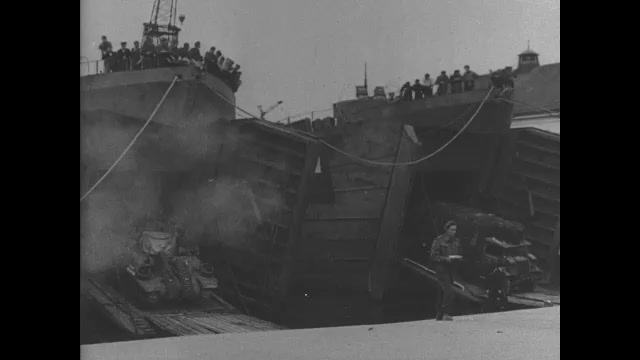 1940s: Military vehicles and soldiers load onto boats. Military trucks ...