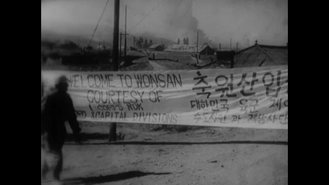1950s: Korean soldiers walk down road. U.S. soldiers walk down road. U ...