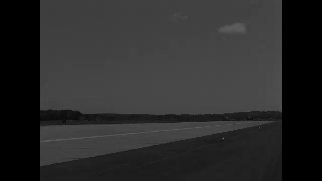 1950s: Jets take off from runway, fly in formation. Line moves around ...