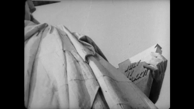 1940s: Statue of Liberty. World map, US, Rising Sun, Swastika flags ...