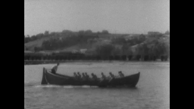1940s: marines in boat rowing in unison, marines getting down and ...