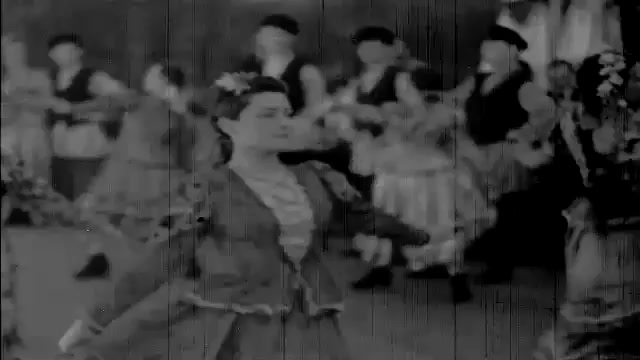 1940s: Dance performance on stage. Crowded city square. Bus. Night ...