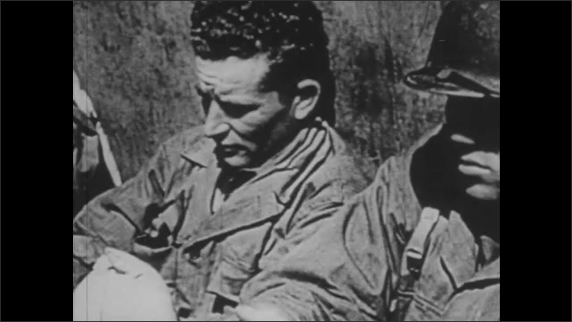 1940s: Ships travel across water. Soldiers sit on ships, smoke ...