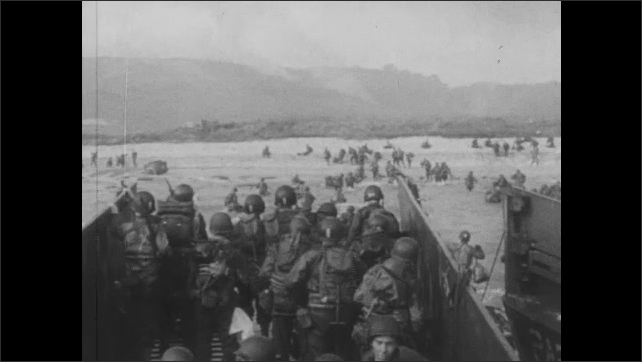 1940s: Ships land on shore, ramps deploy, soldiers disembark. Soldiers ...