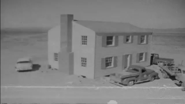 1960s: Two story home destroyed by nuclear explosion. – Archival Footage