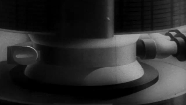1950s: Vacuum tubes and cyclotron sit in laboratory. Animated current ...