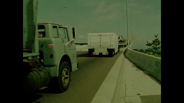 1970s: submarine on large trailer being driven, submarine getting ...