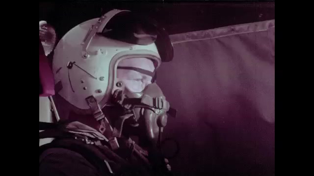 1960s: Pilot in a shaded cockpit. Slate. Pilot and co-pilot in a ...