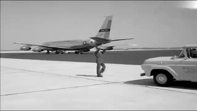1960s: Controller gives hand signals to pilot. Pilot sits in cockpit of ...