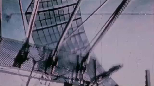 1960s: Radar antennas spin on land and on back of boat. – Archival Footage