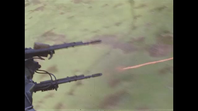 1960s Vietnam: Mounted machine guns fire down from open doors of ...