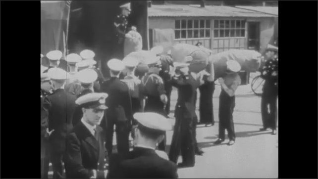 1940s: Troops stand at attention. Military members line up in front of ...