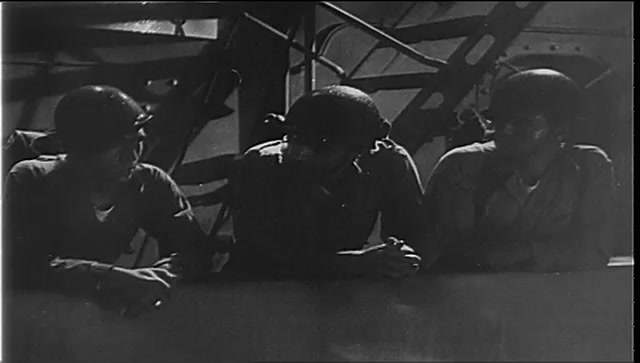 1940s: Soldiers talking. Man in uniform rubbing hands together ...