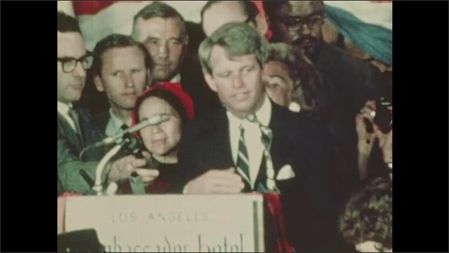 1968: Robert Kennedy gives speech at podium, surrounded by people ...