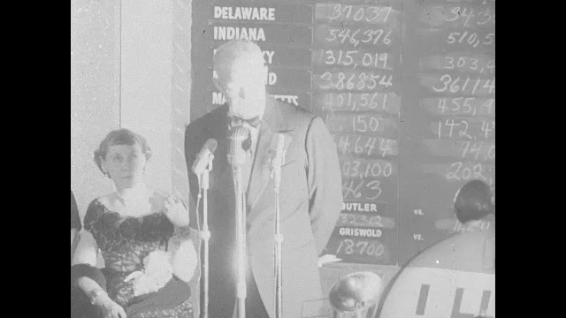 1950s: Dwight Eisenhower talks into microphones on stage, giving ...