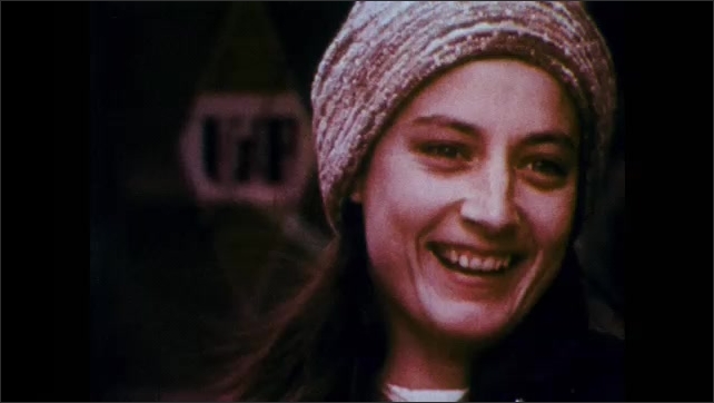 1970s: Electronic billboard display. Women smile. Magazine cover ...