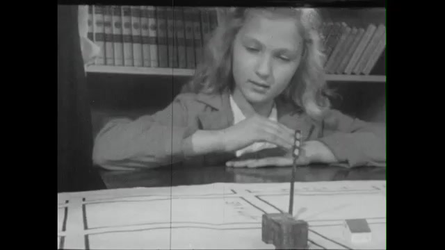 1940s: Teacher places stop sign on map. Students speak. Teacher speaks ...