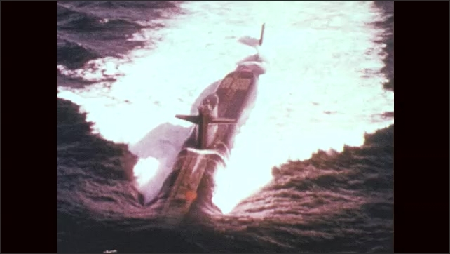 1970s: UNITED STATES: USS Whale (SSN-638) submarine surfaces in ocean ...