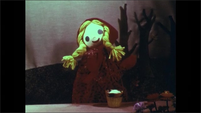 1950s: Hand puppet of Red Riding Hood performs on stage. – Archival Footage