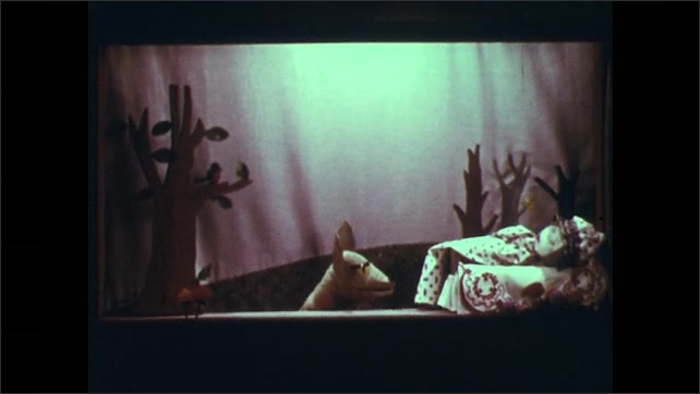 1950s: Hand puppet of woman on stage sleeping in bed as hand puppet of ...