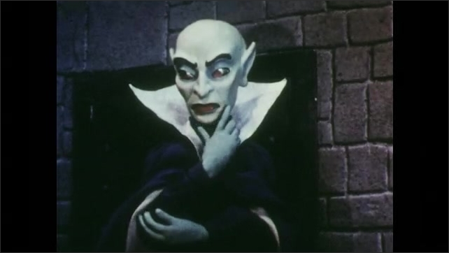 1950s: King counts gold. Strange man appears in puff of smoke. Man ...