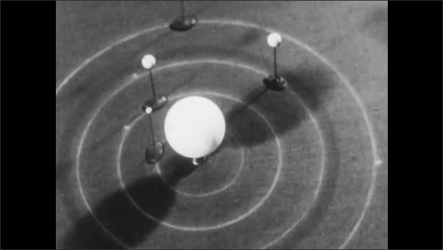 1950s: Diorama of the solar system. The sun and four closest planets ...