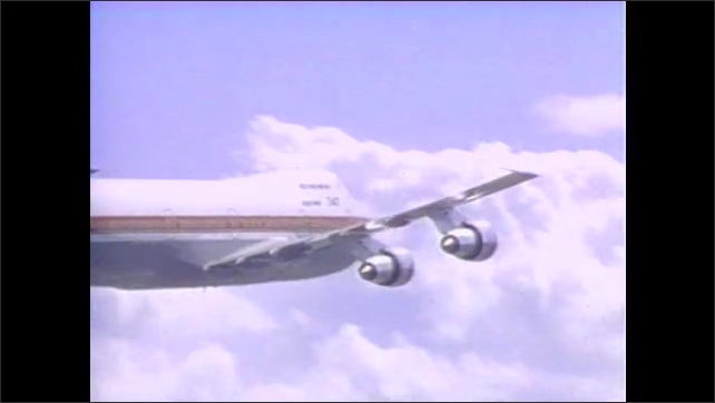 1990s: Pilot in the airplane cockpit in the air. Airplane flies, sky ...