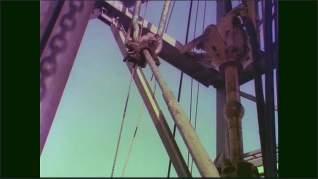 1970s: Workers help maneuver the drill pipe into place on the top of ...