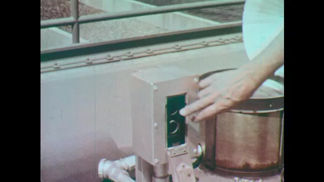 1950s: Man releases water from reservoir. Massive jets of water ...