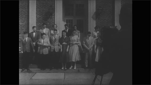 1950s: A group of teenagers in formal wear get in position for a group ...