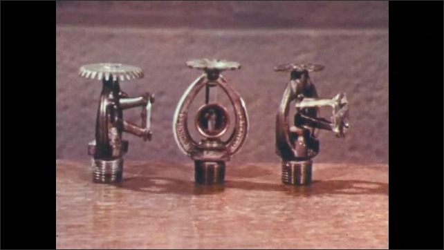 1970s: Pipes hanging from industrial ceiling. Sprinkler head. Ceiling ...