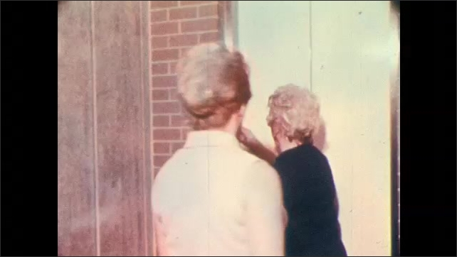 1940s: UNITED STATES: finger creates texture of clothes in clay ...