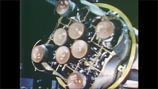 1960s: Saturn rocket booster with eight rocket engines rotates. Saturn ...