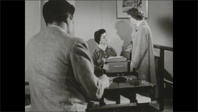 1950s: A small group of adults sitting and listening, woman thinking ...