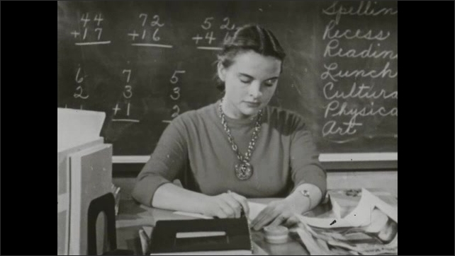 1950s: Teacher watching girl reading, girl disappears. Teacher looking ...